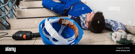 Falling Worker Accident Injured Construction Workman Fallen From Ladder Stock Photo Alamy