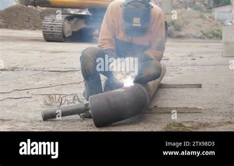 Welding Pipeline Welder Worker Welding Pipe By Electrode Electrodes For Welding And Sparks