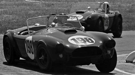Ken Miles In The Factory Cobra Bob Holbert Behind Laguna Seca Bill Hewitt Photo Ford