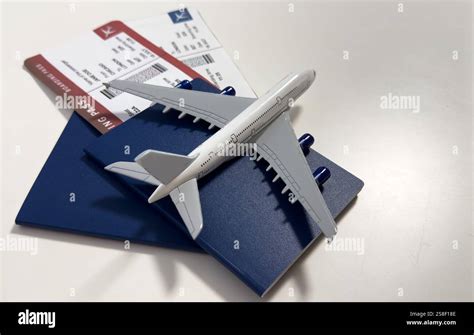 White Blank Model Of Passenger Plane On Passports With Boarding Pass