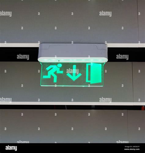 Green Glowing Emergency Exit Sign Stock Photo Alamy