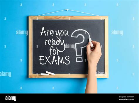 Woman Writing Phrase Are You Ready For Exams With Chalk On Blackboard