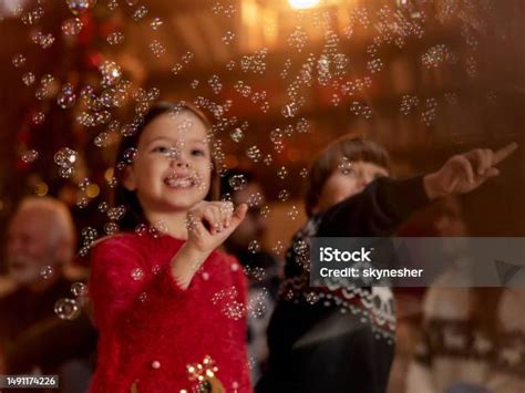 Happy Brother And Sister Having Fun During New Years Eve At Home Stock
