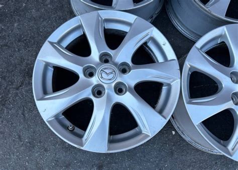 ZappAds: Mazda 3 aluminum 16 inch rims 5 lugs. One is bent. $60 each