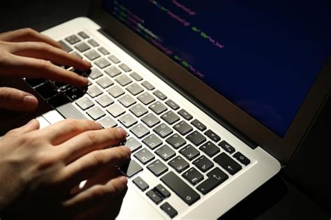 Premium Photo Hacker Using Laptop Closeup