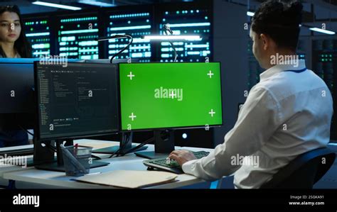 programmer overseeing data center using isolated screen computer