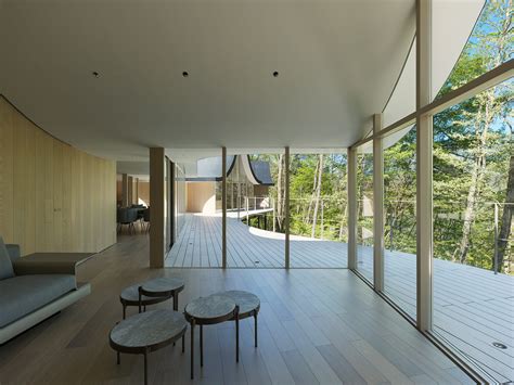 Nendo Weaves Six Cottages Together With Hand Holding Roofs In