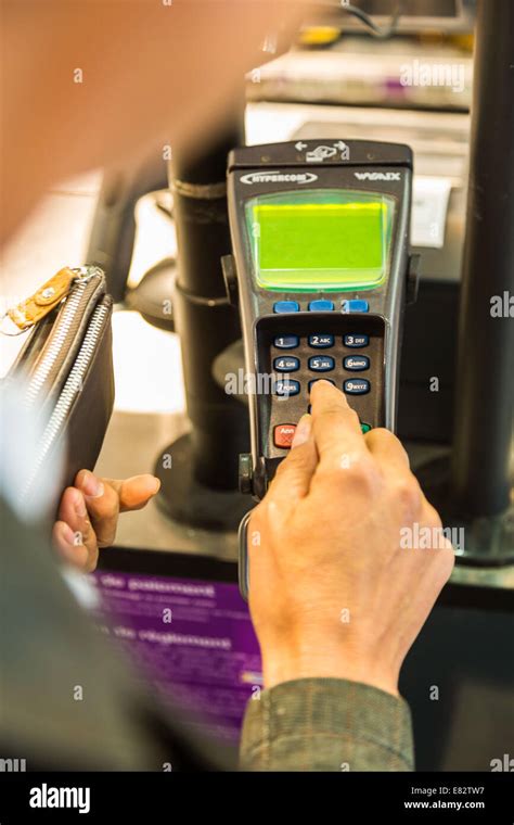 Woman Paying At The Checkout Counter Of Supermarket Stock Photo Alamy