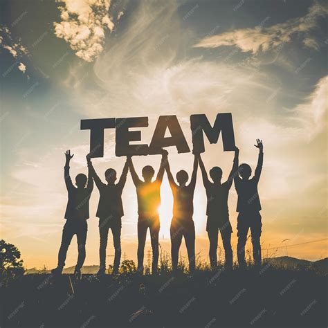Premium Photo Photo Silhouette Of A Group Of Men Who Hold The Word Team Above Themselves