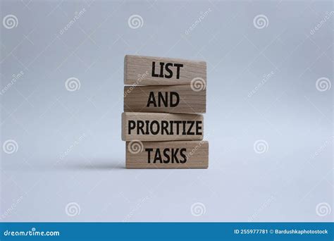 List And Prioritize Tasks Symbol Concept Words List And Prioritize Tasks On Wooden Blocks