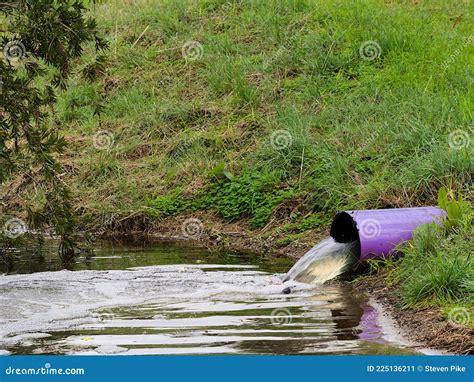 Storm Water Pouring Into An Overflow Pond In The Local Wetlands Royalty
