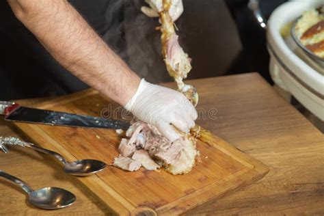 The Cooked Lamb Cut The Meat On The Board Cut The Cooked Lamb With A Knife Stock Image Image
