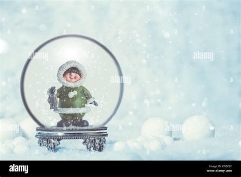 Festive Snowglobe With Eskimo And Falling Snow Portrait Version Also