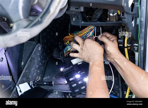 Auto Technician Diagnose And Fixing Wiring Problem Of Car Stock Photo Alamy