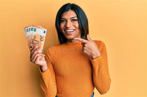 Young Latin Transsexual Transgender Woman Holding Bunch Of 50 Euro