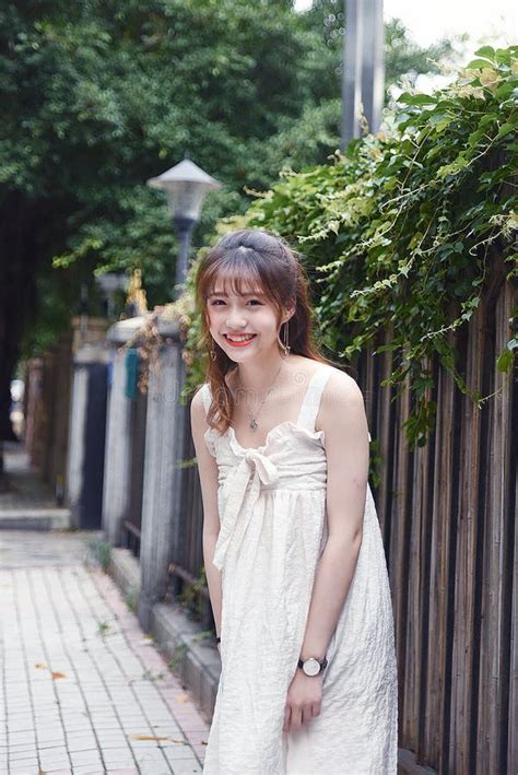 Beautiful And Lovely Asian Girl Shows Her Youth In The Park Stock Image