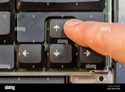 Man Pressing The Up Arrow Key On A Simple Laptop Computer Keyboard Top