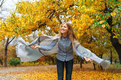Portrait Of A Beautiful Sweet Cheerful Girl Who Walks In The Park In