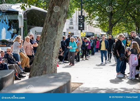 A Queue Of People On South Bank Waiting To See The Queen Lying In State In Westminster Hall