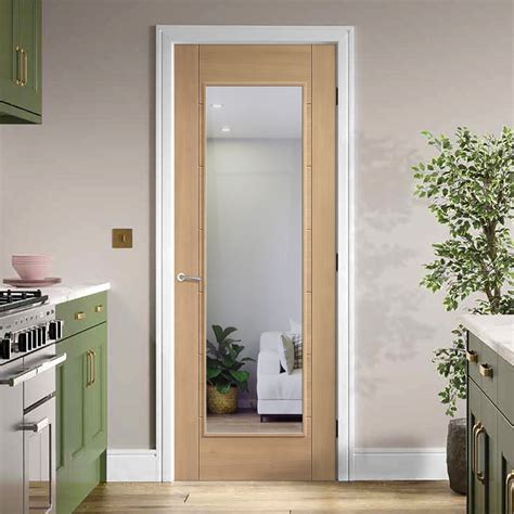 Carini 1l Oak Internal Door Clear Glass Prefinished Direct Doors
