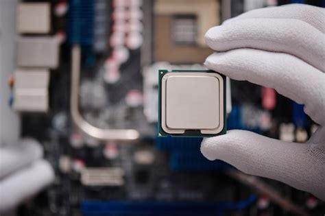 Premium Photo Gloved Hand Of Technician Carefully Holding CPU