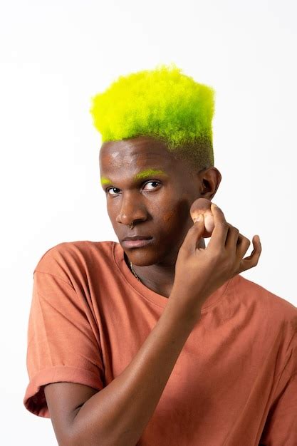 Premium Photo An Androgynous Black Man Posing Putting On Makeup Lgtbi