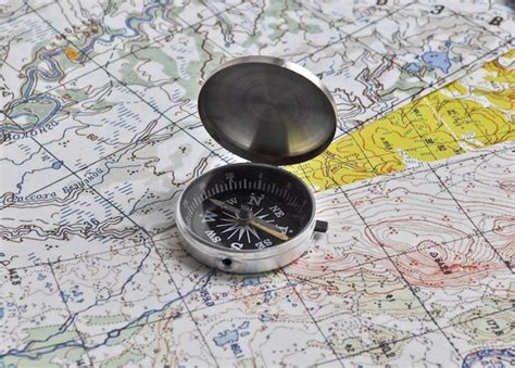 Premium Photo Map And Compass