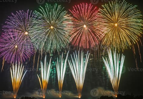 Multiple Fireworks Of Different Colors Going Off Simultaneously