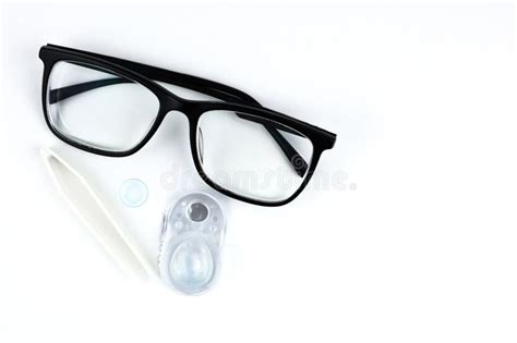 On The Left Of The Photo There Are Close Ups Of Black Framed Glasses