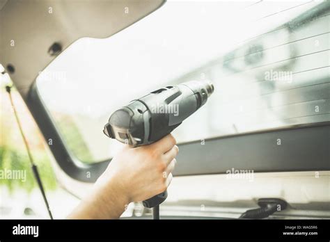 Heat Shrinking Window Film Rear Car Window Stock Photo Alamy