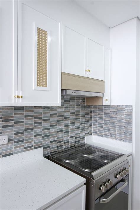 White And Bare Asian Kitchen With Small Horizontal Patterned Tiles