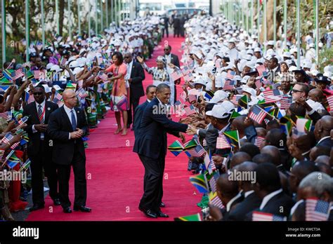 President Barack Obama And First Lady Michelle Obama Shake Hands With