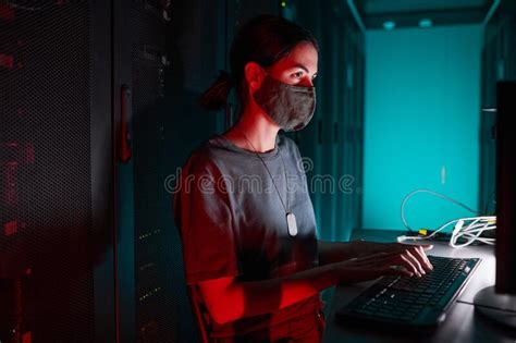 Female Network Engineer Wearing Mask In Data Center Stock Photo Image Of Female Typing 216547582