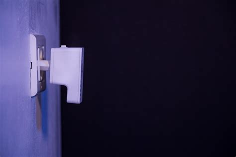 Premium Photo Wifi Repeater In Electrical Socket On The Wall