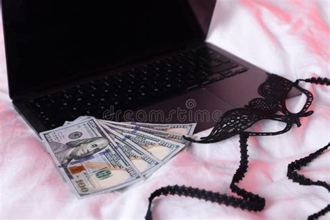 Prostitution And Virtual Sex Laptop Dollar Banknotes And Mask On Linens Stock Photo Image Of