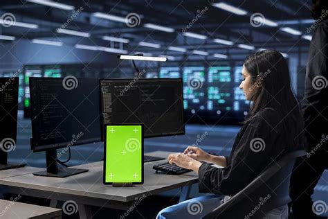 Woman Checking Data Center Systems Bottlenecks Using Mockup Tablet