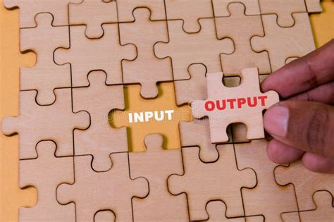 Connection Of Input And Output Puzzle Pieces On Table Stock Image