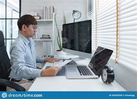 Software Development Concept Male Programmer Read Data On Document