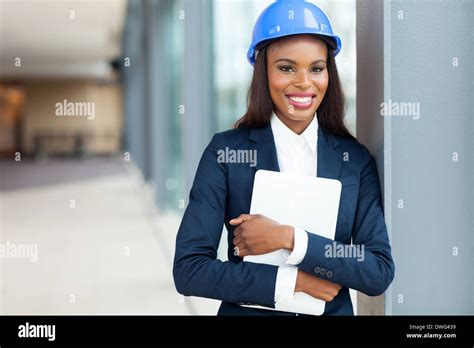 Beautiful African Construction Engineer Holding Laptop Computer Stock