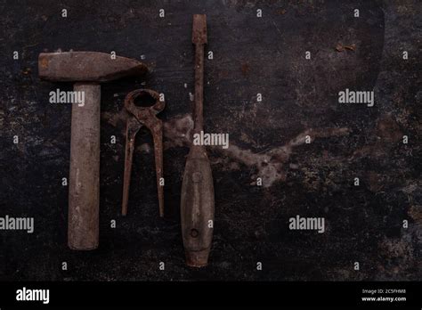 old tools hammer chisel spatula measuring tape and brushes greasy