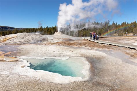 Lion Geyser eruption creates a rainbow near Heart Spring in Yellowstone ...