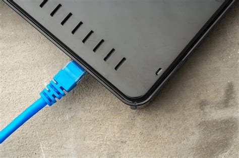 Premium Photo Modern Router With Cables Plugged In Close Up