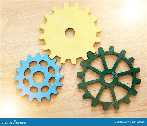 Collaboration Engineering And Construction Concept With Industrial Gears Mechanics And Cogs On