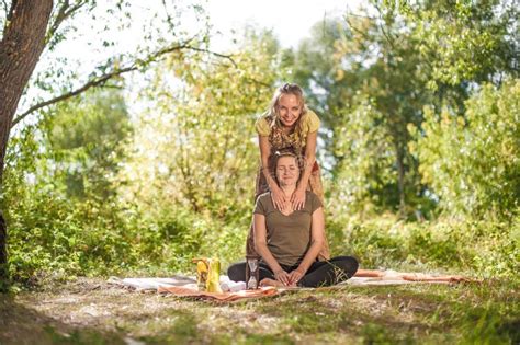 Healer Provides A Thorough Massage In A Forest Clearing Stock Image