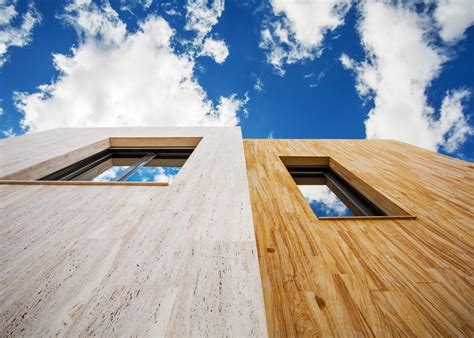 Ooiio Architectures Staggered And Stone Clad Block House