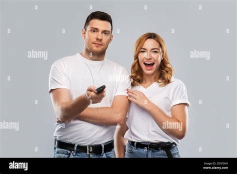 Couple With Tv Remote Control Stock Photo Alamy