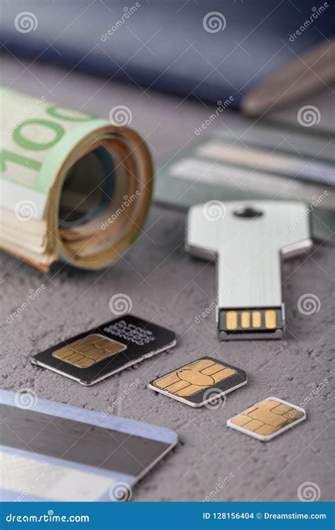 Three SIM Cards Of Different Sizes Lie On A Rough Surface Close Up Stock Photo Image Of Money