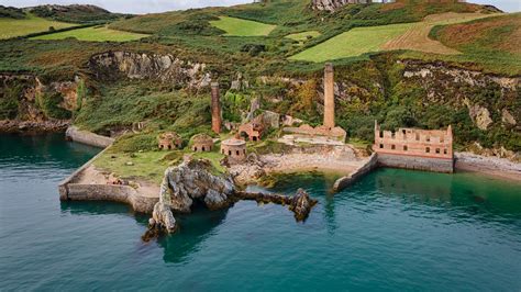 The Surreal Uk Beach Where You Can Explore Abandoned Buildings Next To Clear Blue Seas The