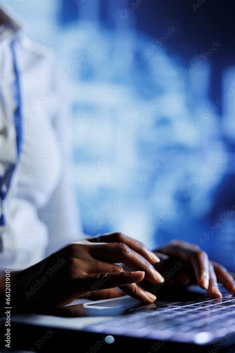 computer operator uses laptop to develop artificial intelligence neural
