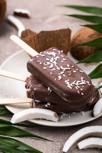 Premium Photo Coconut Popsicles In Chocolate Glaze